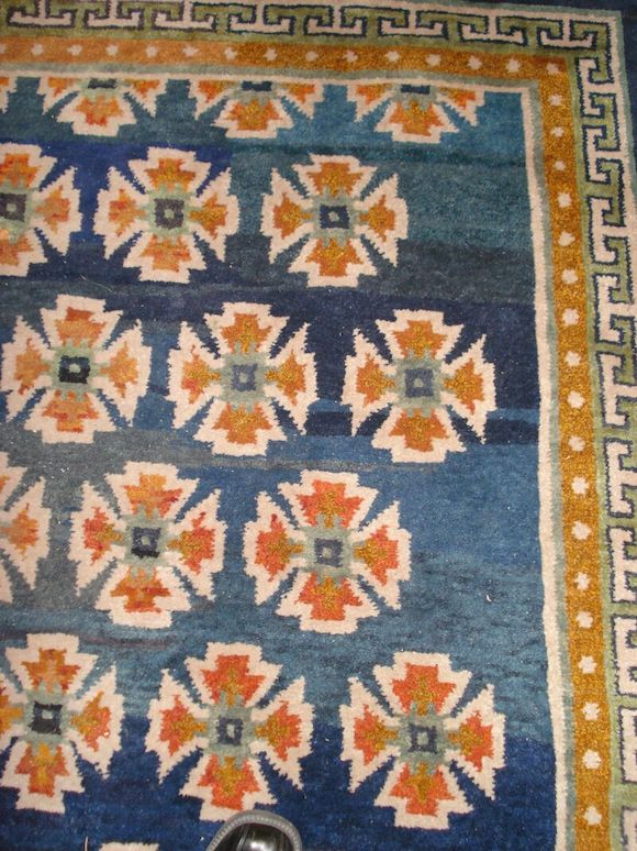 Bonhams : A modern Tibetan 'Double Dorje' pattern wool rug,