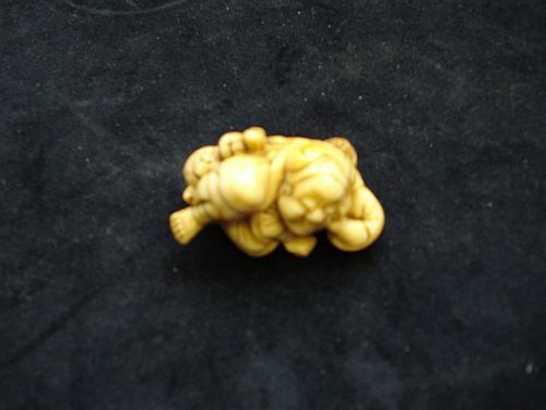 Bonhams : An amusing netsuke of a Sarumawashi dozing beside his monkey;