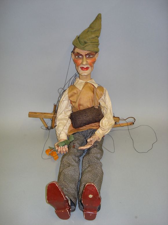 Bonhams : A well carved wooden Marionette of a European traveller
