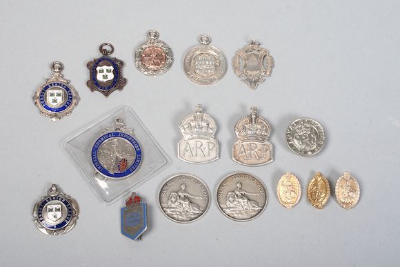 Bonhams : A collection of 9ct gold, silver and enamel decorated badges ...