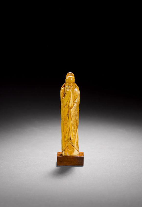 Bonhams : An ivory figure of an official Ming Dynasty