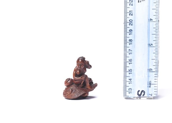 Bonhams : A wood figure of an ama (diving girl) on an awabi shell By ...