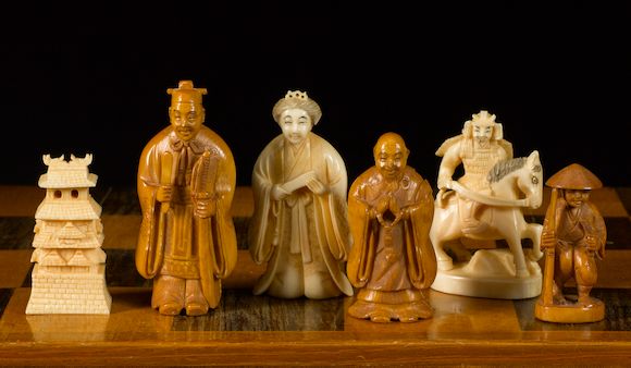 Bonhams : A carved ivory netsuke figural chess set, Japan, circa 1950,