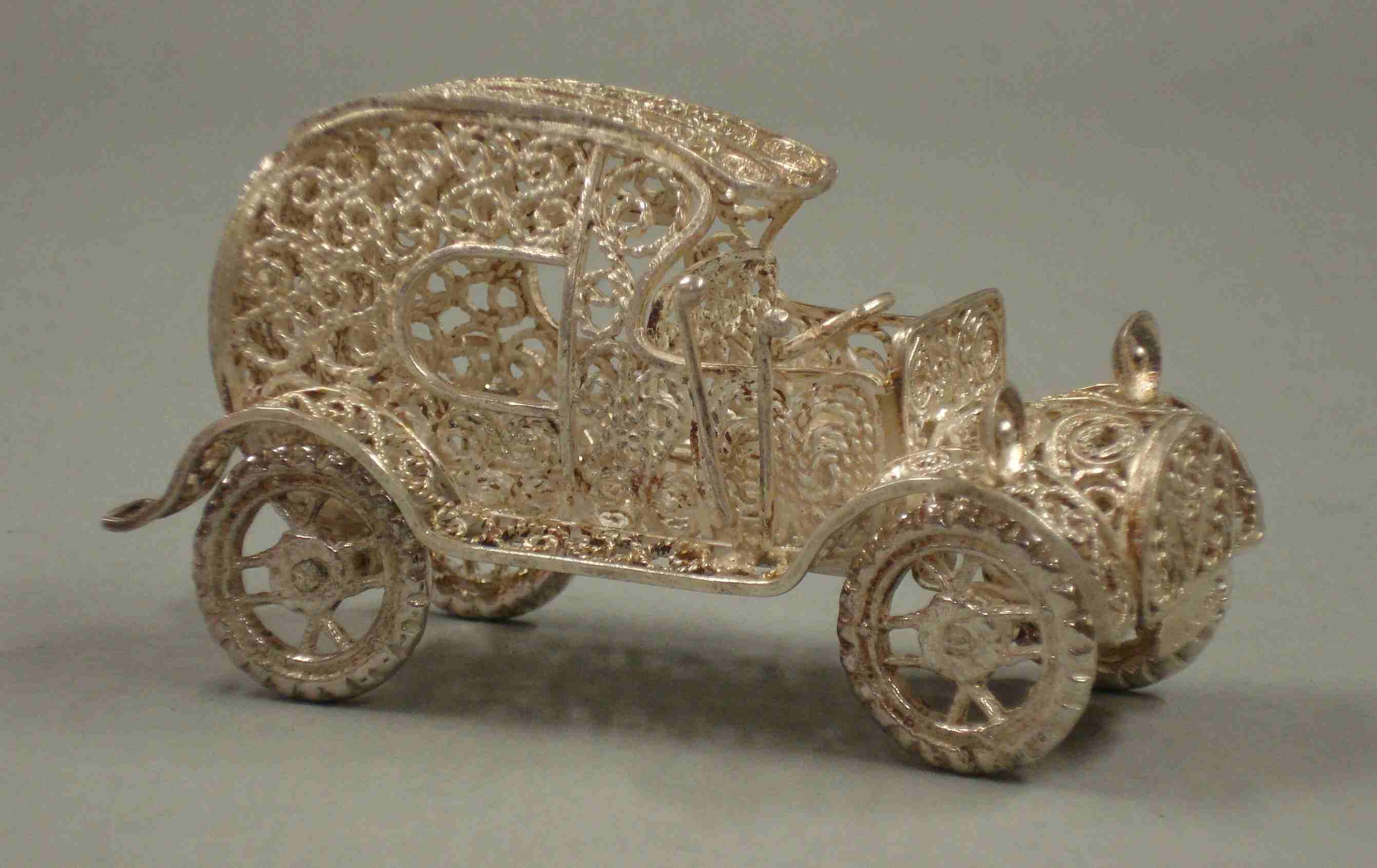 Bonhams Cars : A Fine silver decorative veteran car model,
