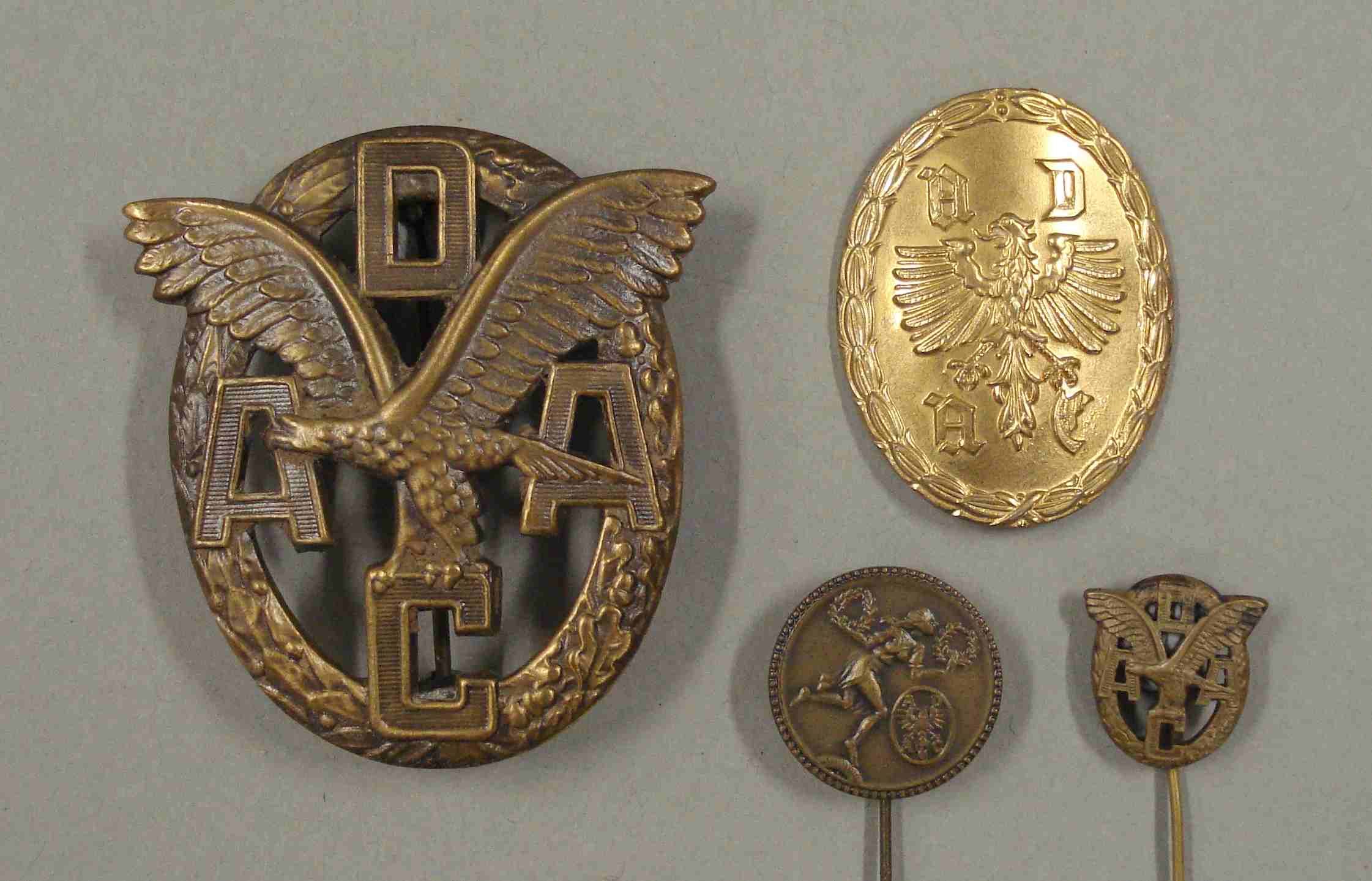 Bonhams Cars : A DAAC lapel badge, 1930,