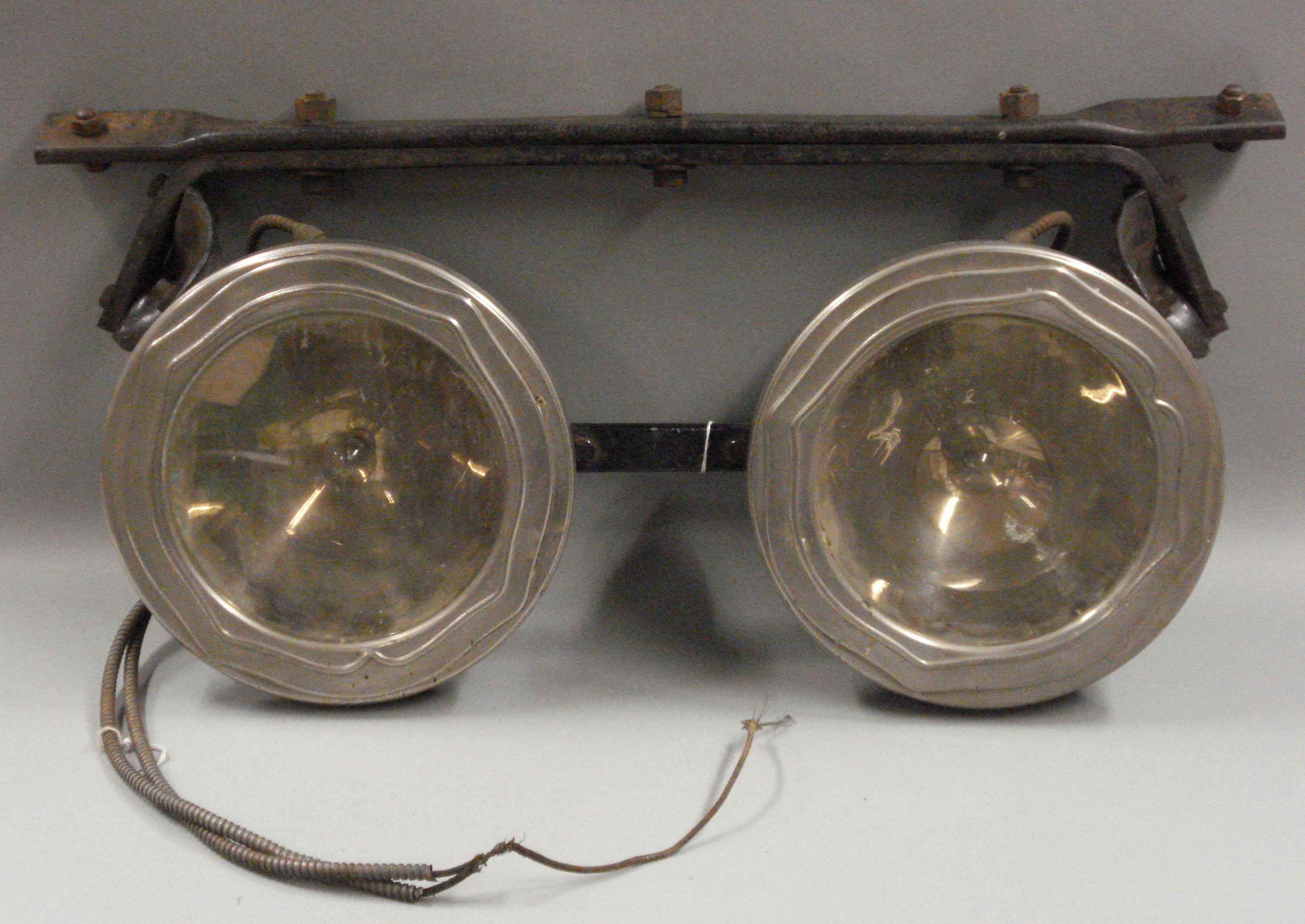 Bonhams Cars : A pair of biscuit tin lamps,