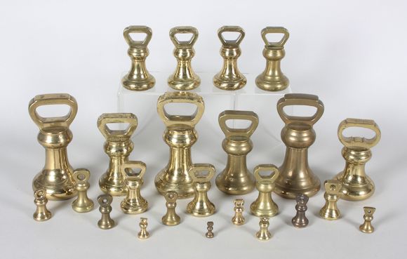 Bonhams : A large collection of polished brass bell shaped weights