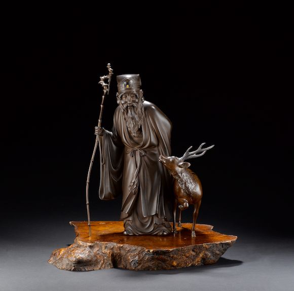 Bonhams : An elegant bronze okimono of Jurojin and his stag;