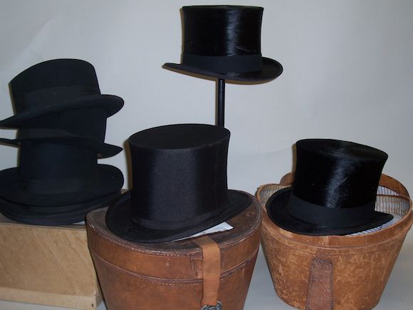 Bonhams : Two top hats in leather top hat cases