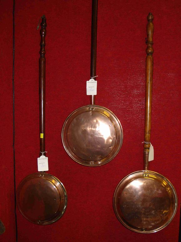 Bonhams : Two 19th century brass bed warming pans