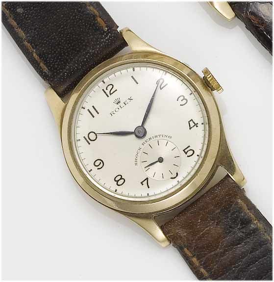 Bonhams : Rolex. A 9ct gold round cased wristwatchBirmingham Hallmark ...