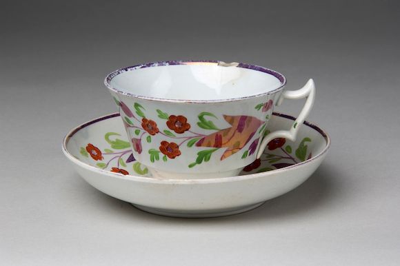 Bonhams : A Cambrian Pottery tea cup and saucer circa 1811-17
