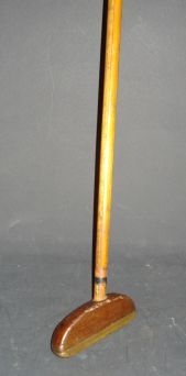 Bonhams : A patented George Nicoll centre shafted wooden putter