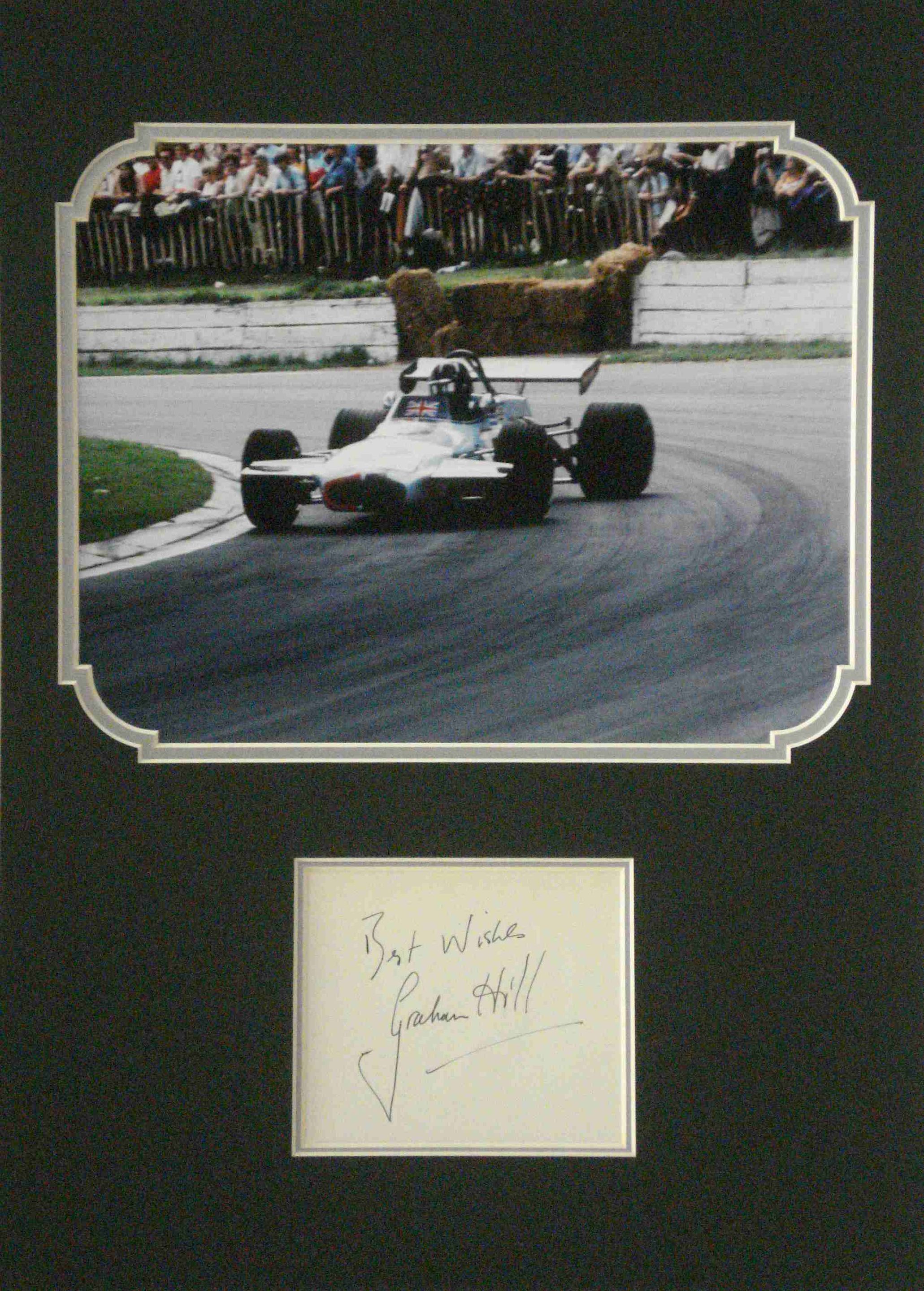 Bonhams Cars : A photograph of Graham Hill mounted with signature,