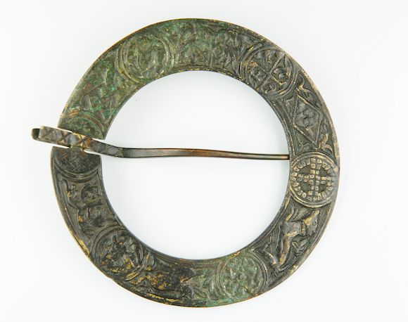 Bonhams : A 19th century brass pennanular brooch in the 17th century style