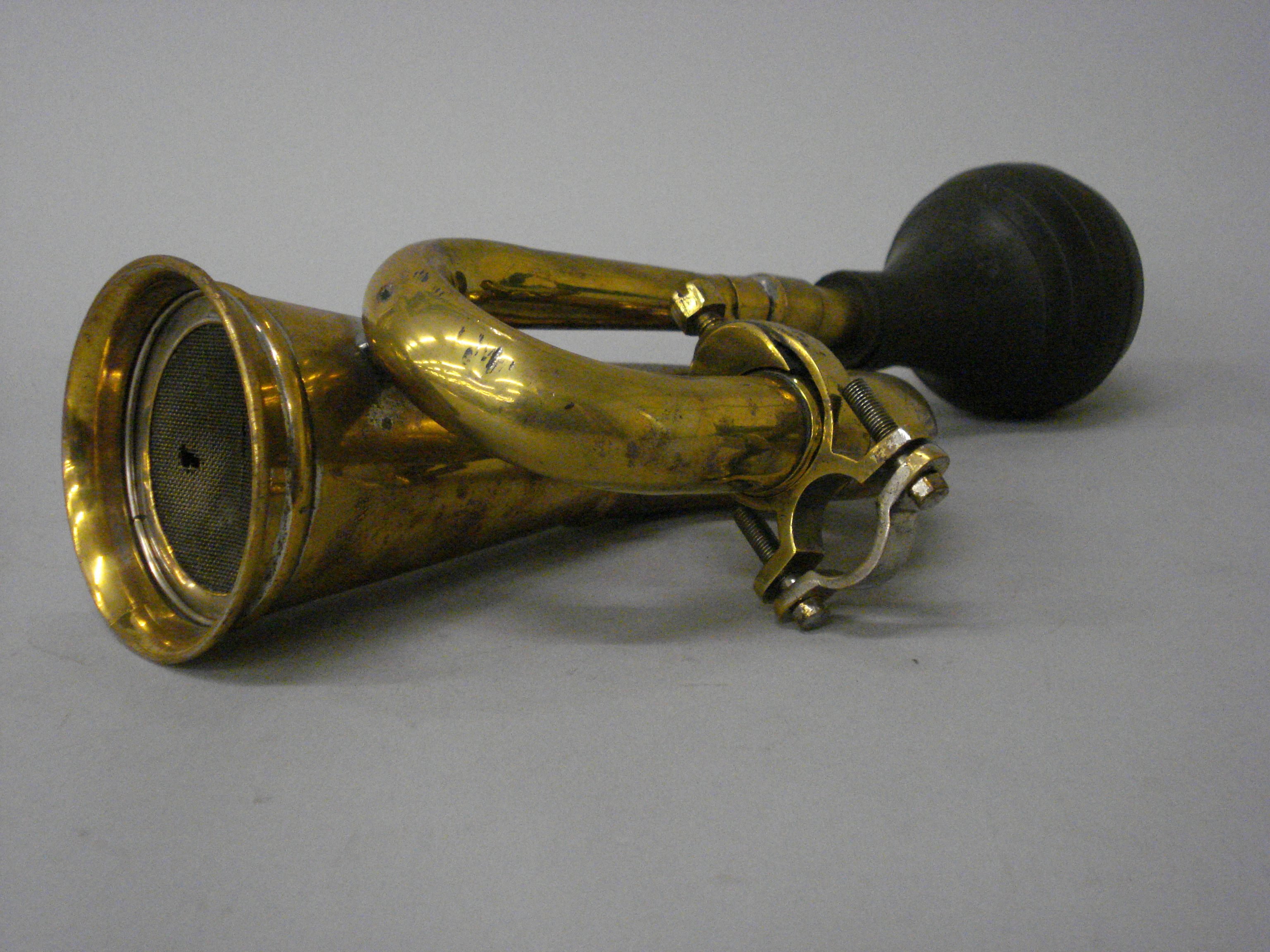 Bonhams Cars : Two single twist bulb horns,