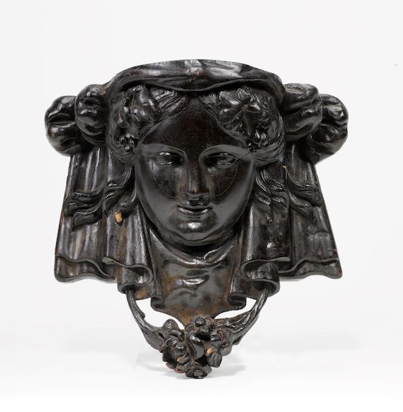 Bonhams : A carved wood bracket in the form of a Bacchic female mask
