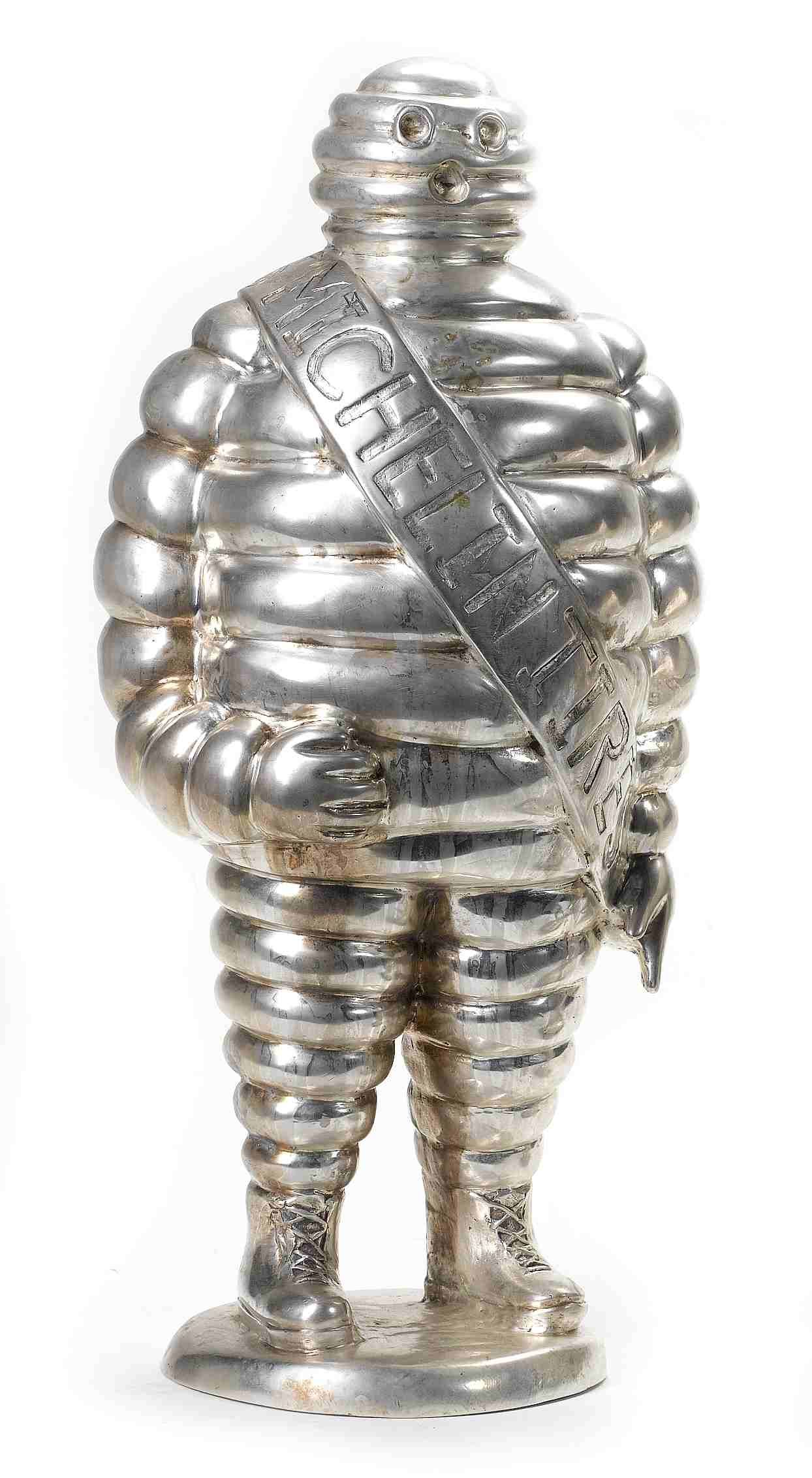 Bonhams Cars : A cast metal Bibendum advertising figure,