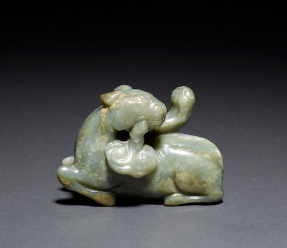 Bonhams : A spinach-green jade figure of a recumbent goat Ming Dynasty ...