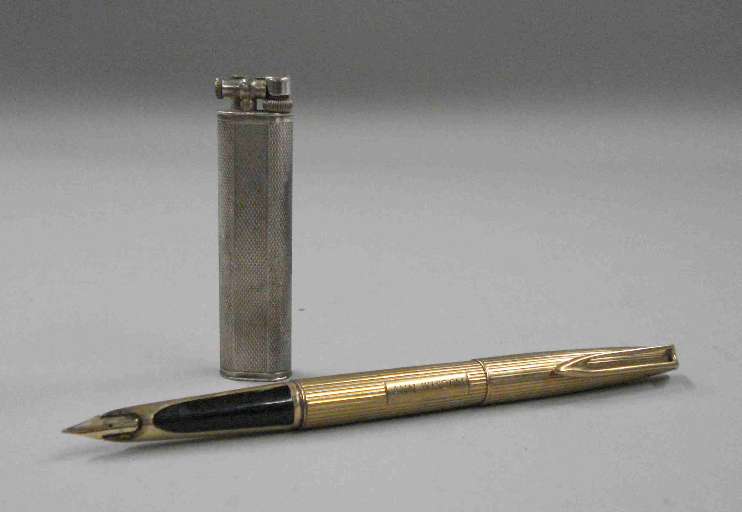 Bonhams Cars : A Dunhill cigarette lighter and gold pen,