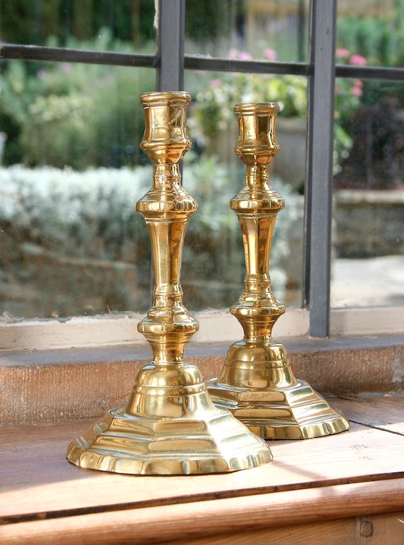 Bonhams : A pair of late 18th Century French brass candlesticks