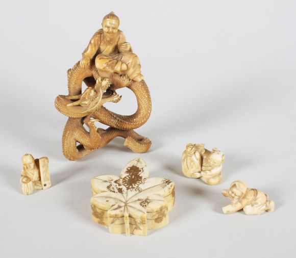 Bonhams : A Japanese sectional ivory box, a figure seated on a dragon ...