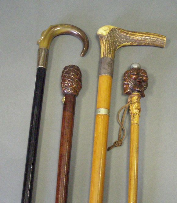 Bonhams : A 19th century leather covered cane, and three further sticks