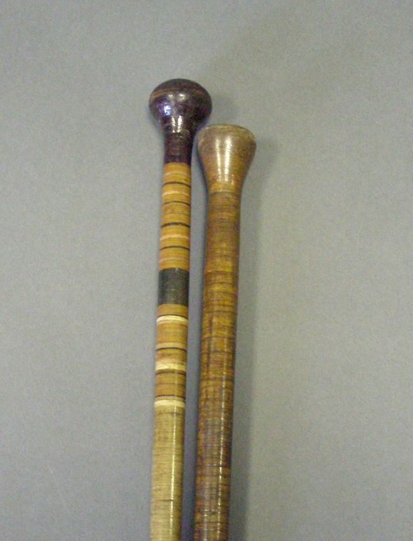 Bonhams : Two wooden washer sticks,