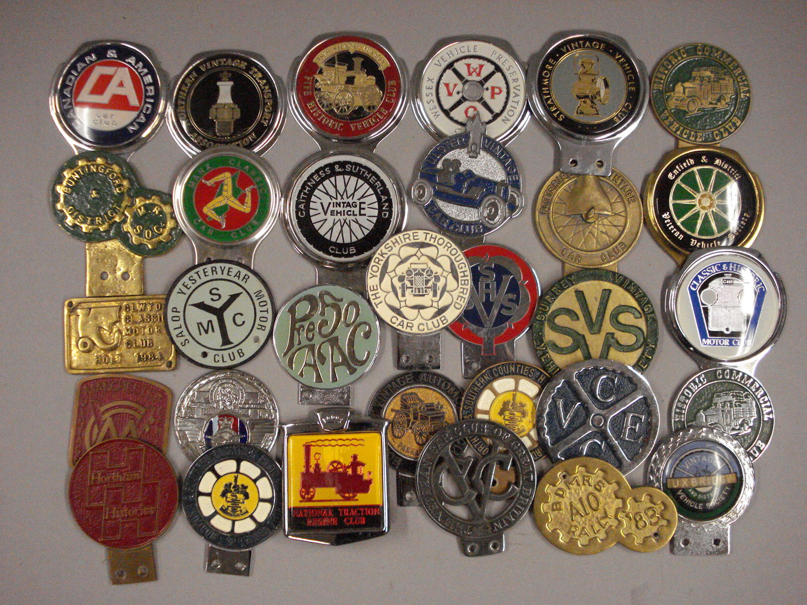Bonhams Cars : Assorted motoring badges,