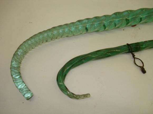 Bonhams : A Nailsea style solid green glass spiralled walking cane