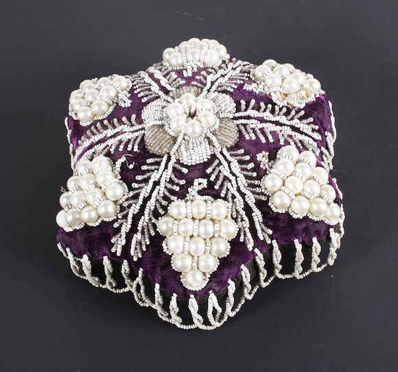 Bonhams : A large Victorian purple velvet table pincushion