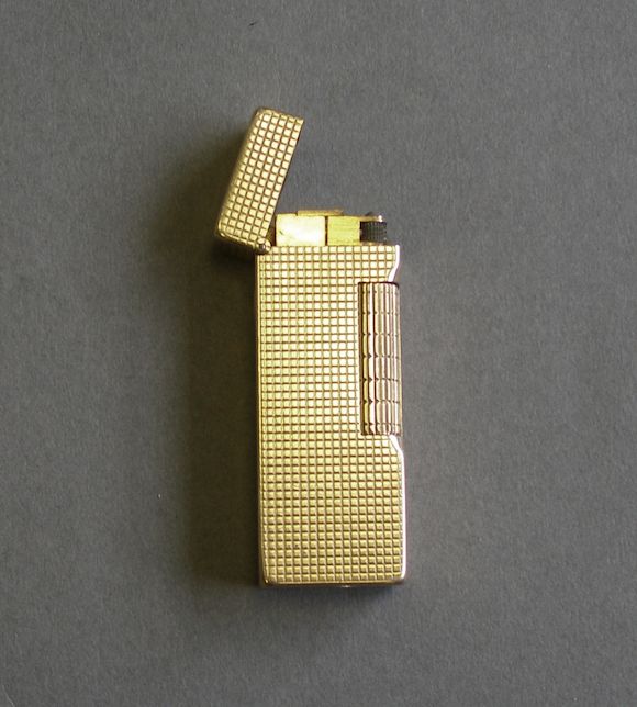 Bonhams : DUNHILL: A cased 9 carat gold 'Rollalite' lighter, by Alfred ...