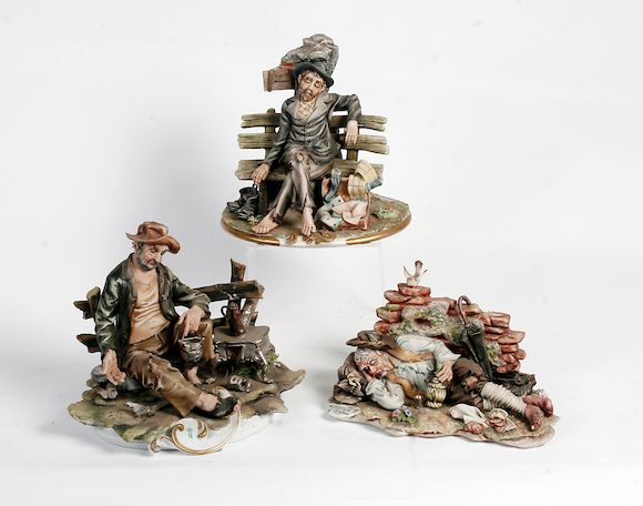 Bonhams : A Capo di Monte style figure of a tramp resting on a bench