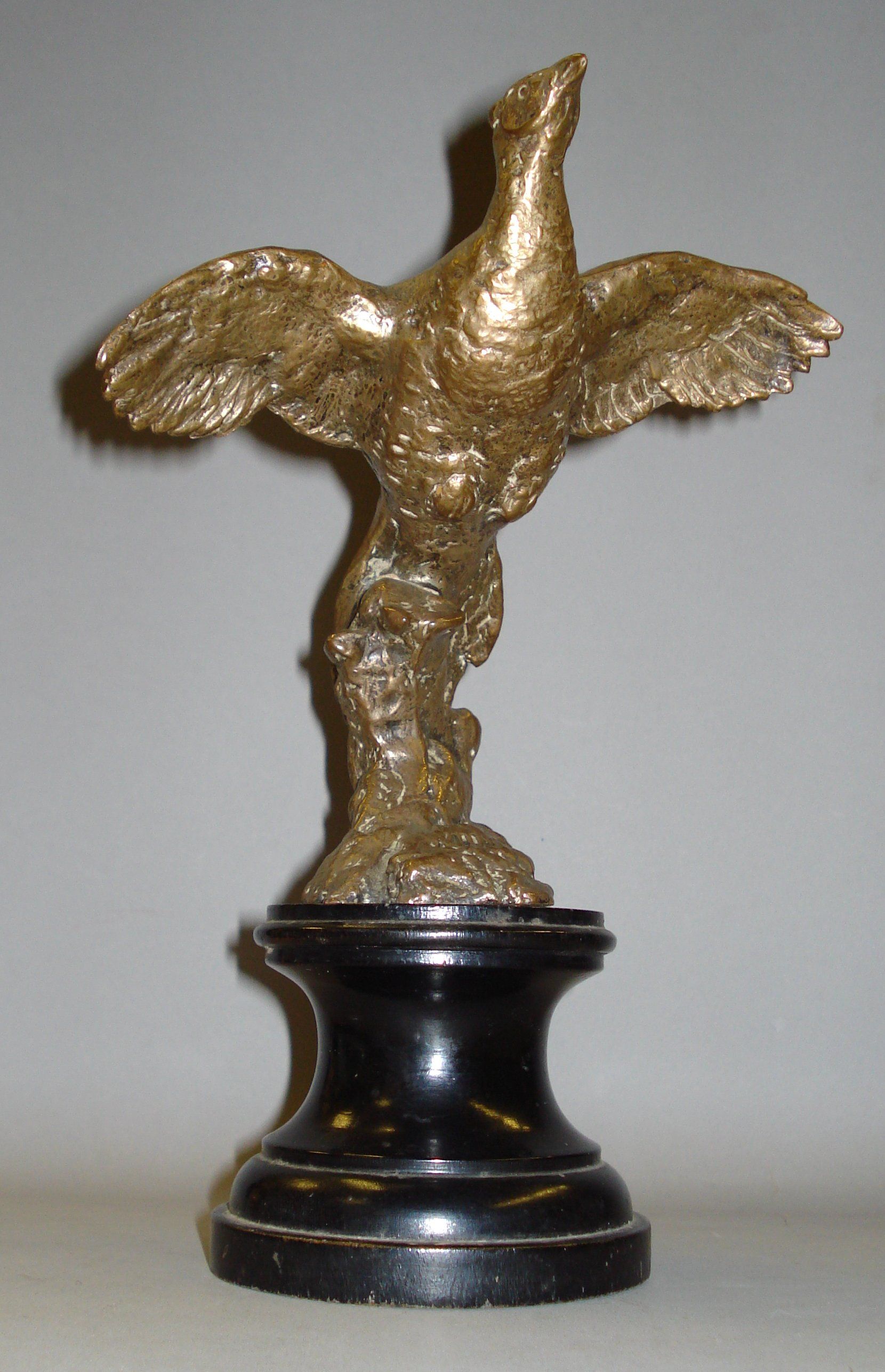 Bonhams Cars : A bronze pheasant mascot, British, c1930,
