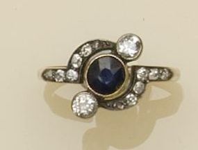 Bonhams : A three stone sapphire and diamond crossover ring
