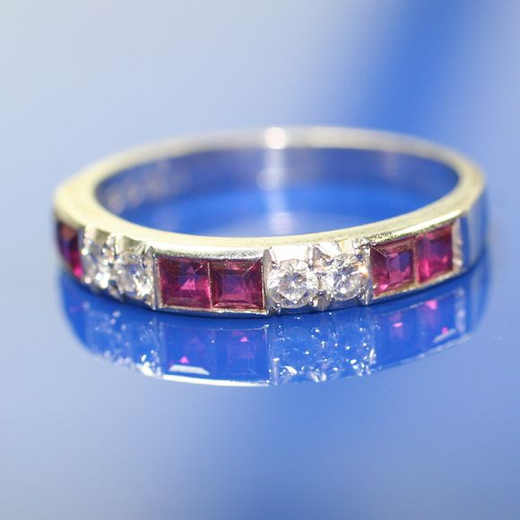 Bonhams : A ruby and diamond half eternity ring