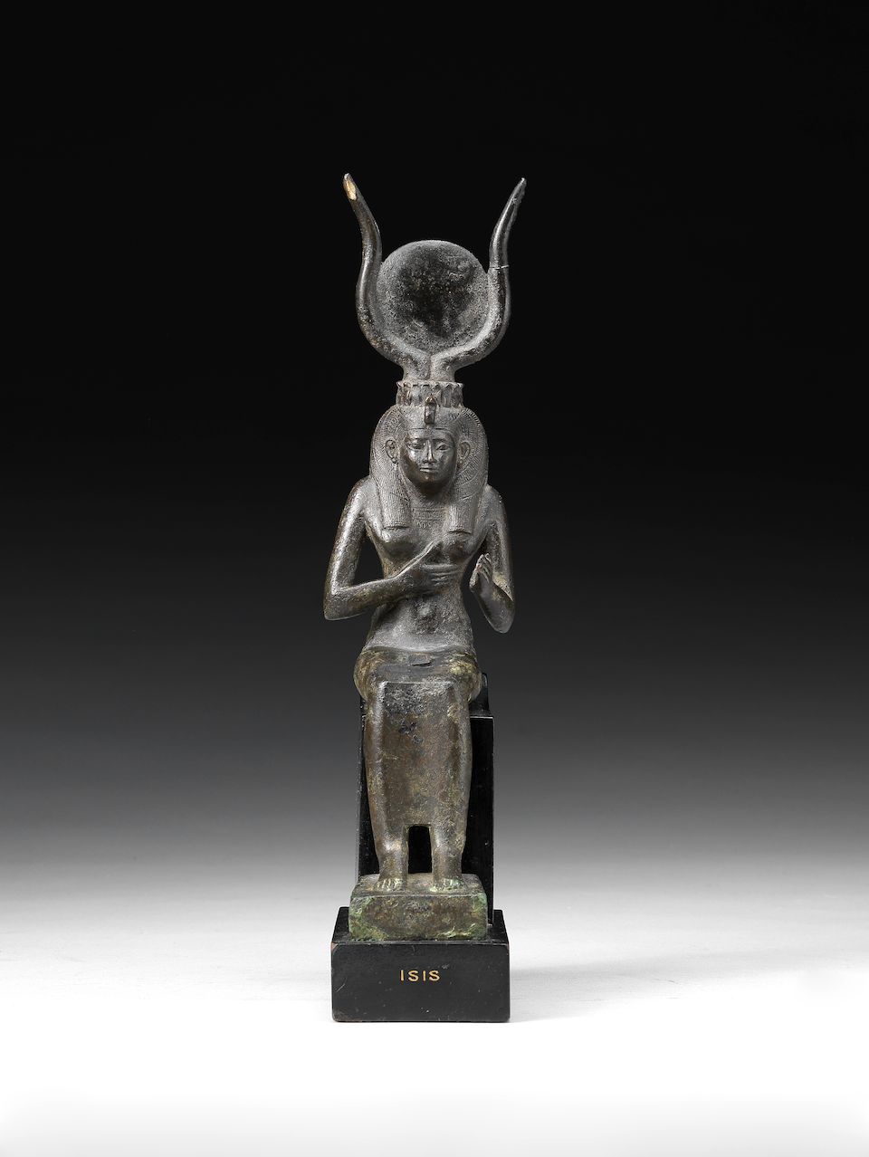 Bonhams : An Egyptian bronze figure of Isis