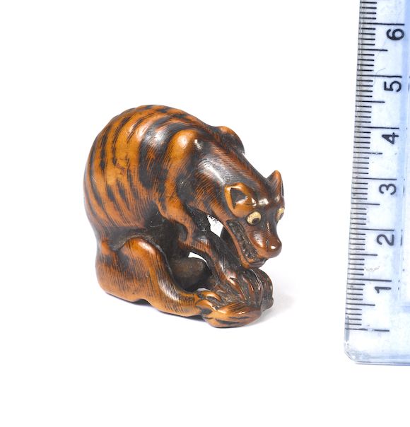 Bonhams : A wood netsuke of a yamainu (wild dog) Early 19th century