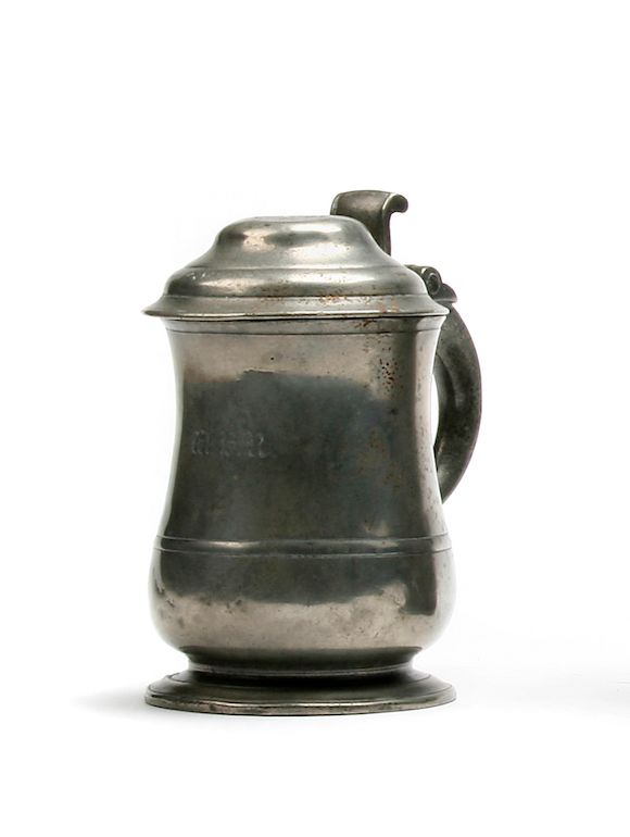 Bonhams : A mid 18th Century half-pint tulip shaped dome lidded tankard