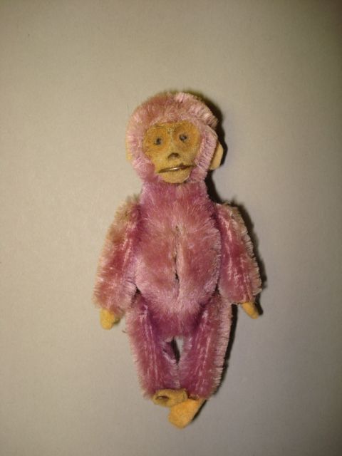 Bonhams : Miniature Schuco monkey compact, German 1920's