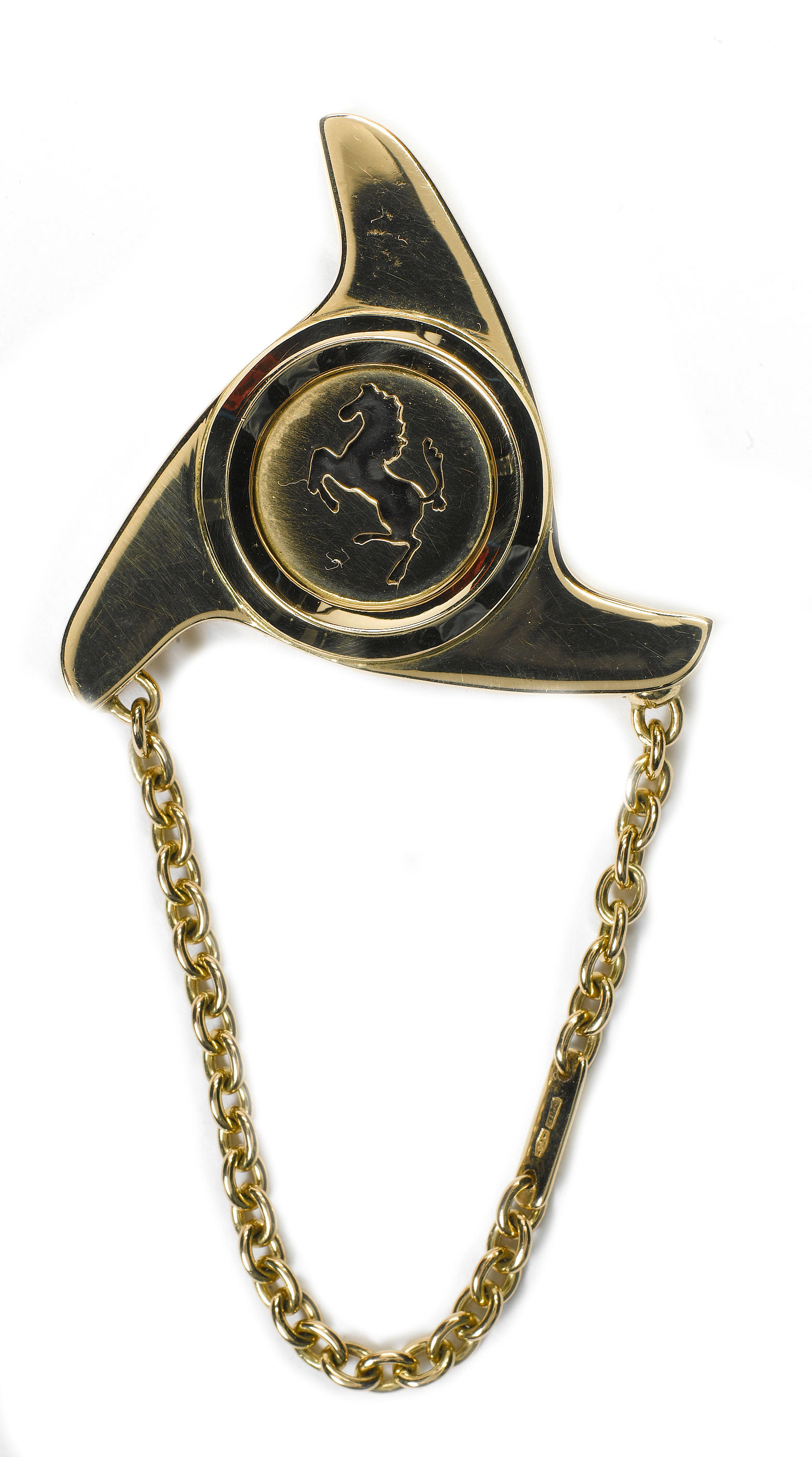 Bonhams Cars : A gold Ferrari commemorative keychain, dated 1988,