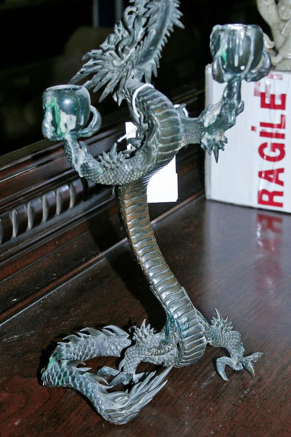 Bonhams : An early 20th century Eastern bronze dragon candlestick
