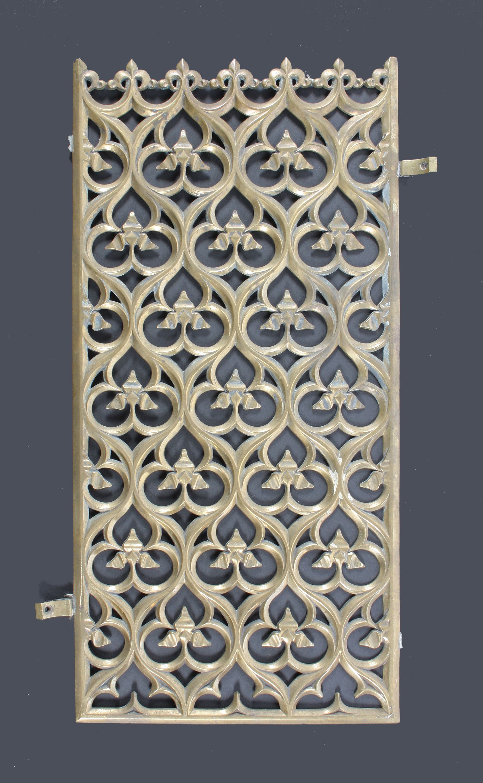 A Gothic Revival cast and pierced brass rectangular interior door ...