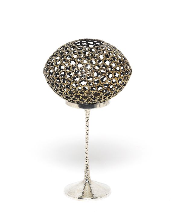 Bonhams : STUART DEVLIN: A silver and silver-gilt candlestick, London 1975,