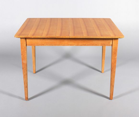 Bonhams : A Gordon Russell walnut veneered and beech extending dining ...