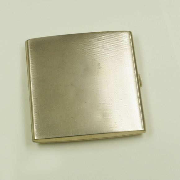 Bonhams : A 9ct gold square cigarette case