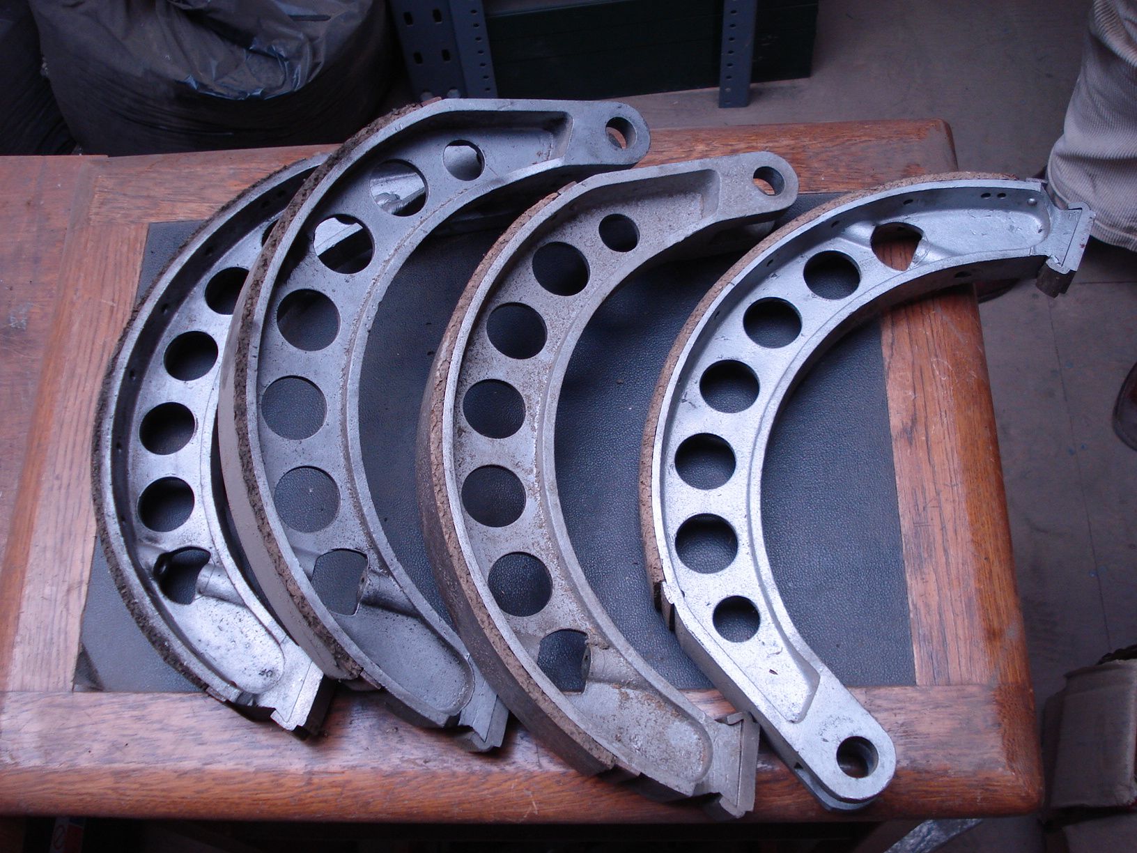 Bonhams Cars : Four vintage Bentley brake shoe assembly brackets,