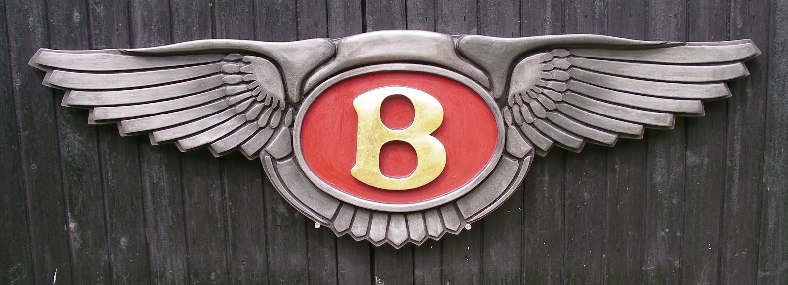 Bonhams Cars : A cold-cast aluminium composite Bentley Winged 'B' emblem,