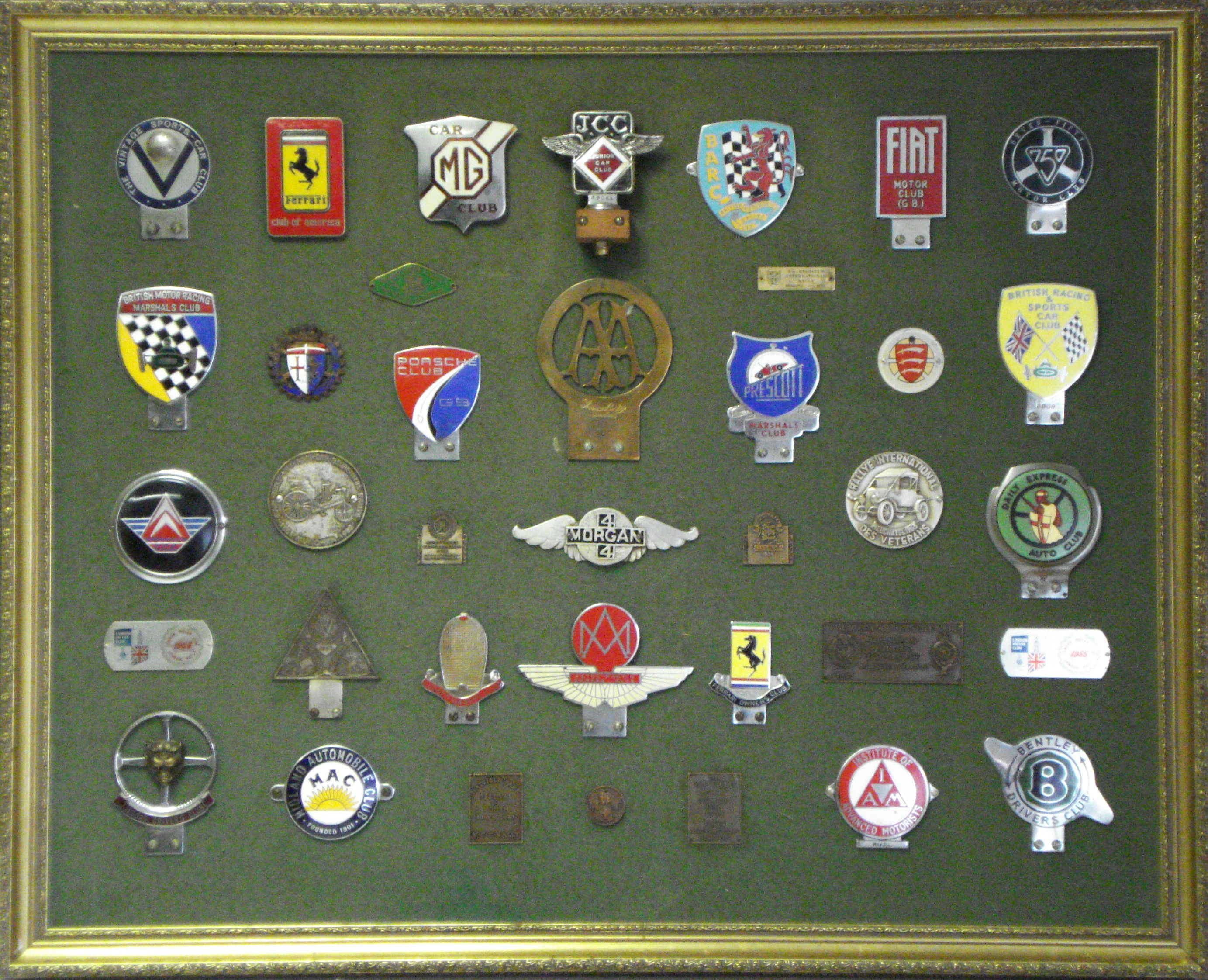 Bonhams Cars : A framed display of car badges,