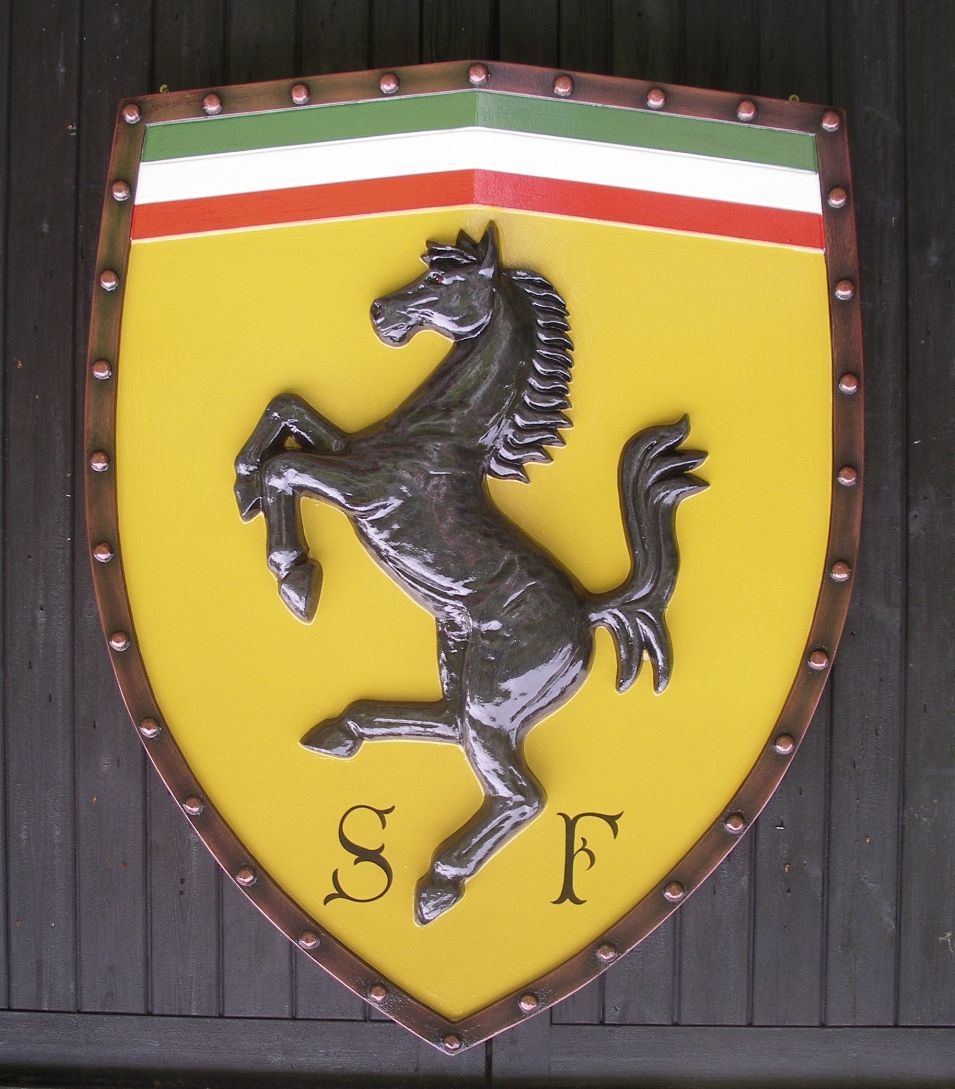 Bonhams Cars : A hand painted glass fibre Ferrari shield in relief,